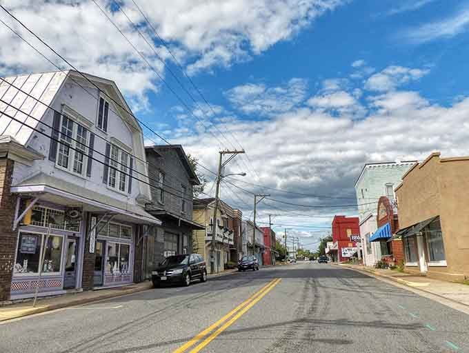 Weathered storefronts create natural shade along streets where people actually walk instead of just driving through town.