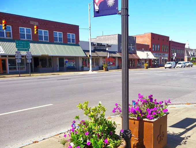 Vibrant flower boxes brighten the streetscape, proving small towns still care about making things look pretty.