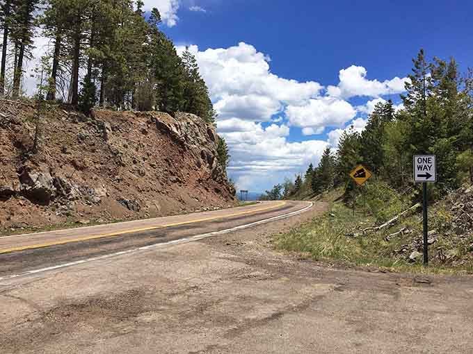 Pine-studded slopes and dramatic cloud formations create a high-altitude paradise that feels worlds away from desert heat below.