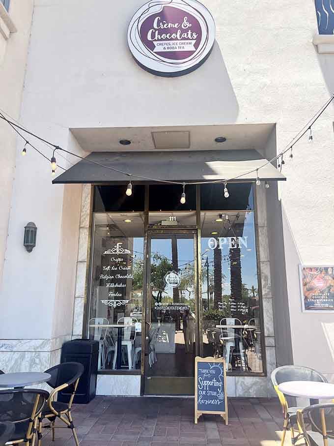 String lights and a welcoming entrance promise Belgian chocolate dreams and creamy soft serve adventures await you here.