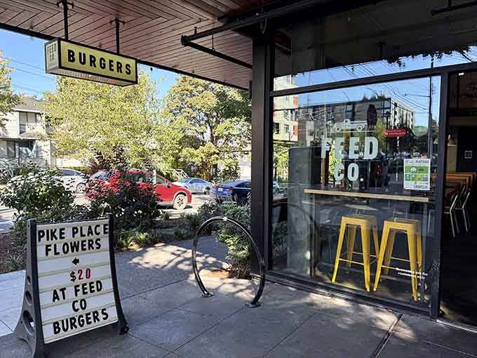 Large windows reveal the burger-making action inside, where neighborhood magic happens one massive patty at a time every day.