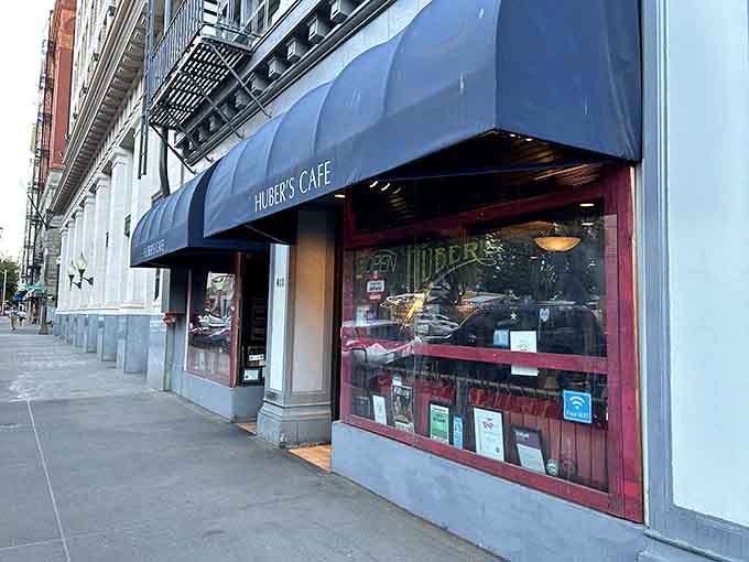 The elegant awning and polished windows hint at the old-world dining experience waiting inside this beloved Portland institution.