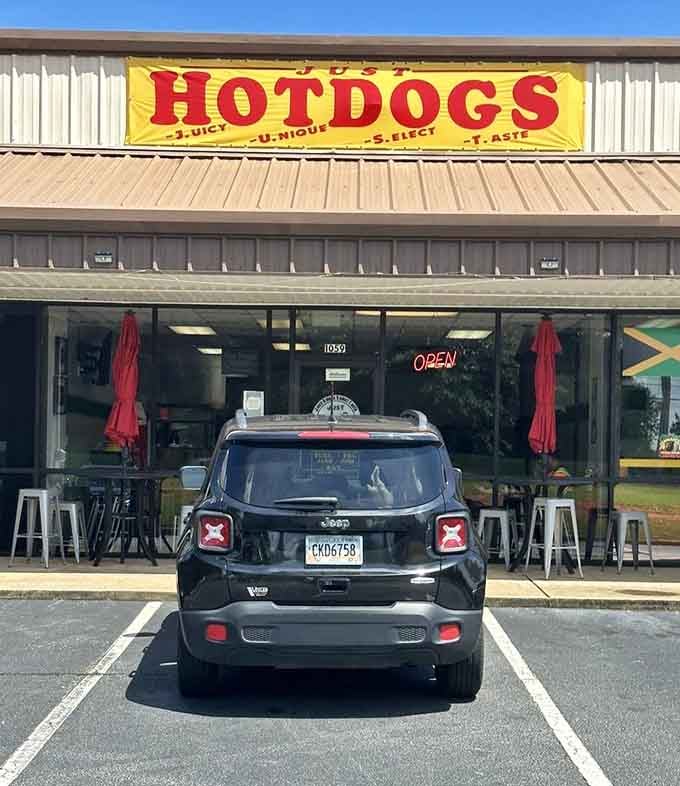 The simple storefront hides nothing, proudly declaring its hot dog devotion with that massive sign visible from blocks away.