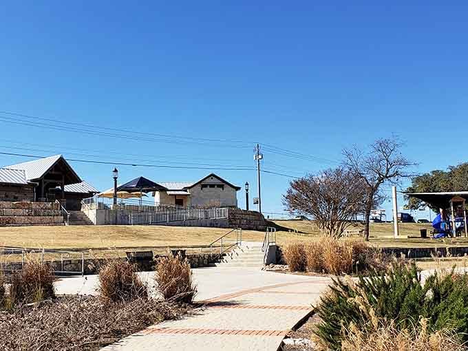 Winding pathways through native landscaping lead to gathering spots perfect for morning coffee and conversation.