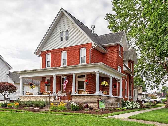 This red brick beauty with its wraparound porch looks like every grandmother's house should, welcoming and timelessly elegant.