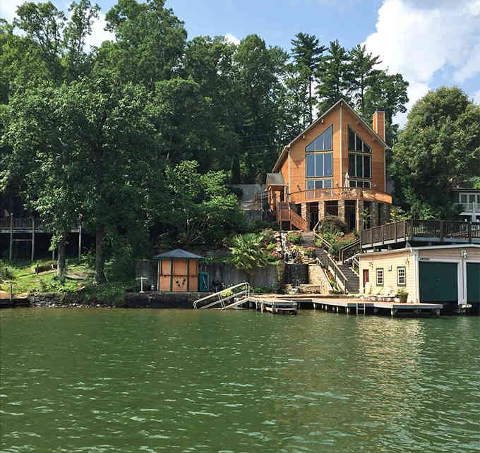 That lakeside retreat with its own water slide looks like something from a lottery winner's wish list.
