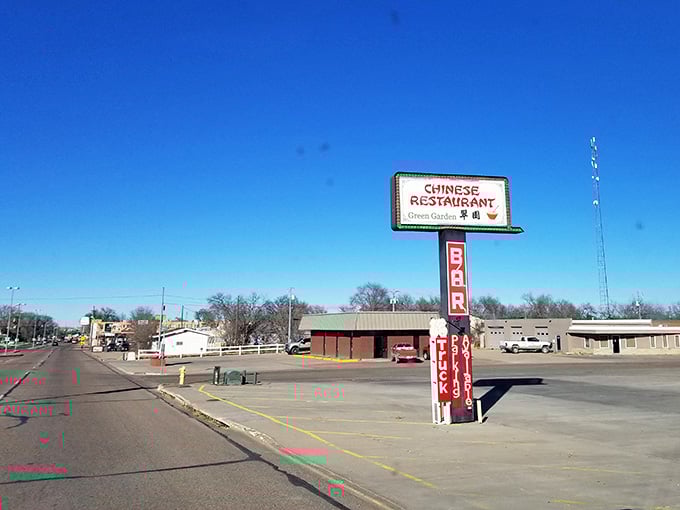That vintage Chinese restaurant sign stands tall like a beacon from another era, promising authentic flavors on the plains.