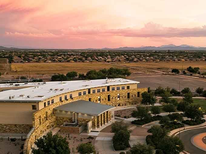 Those winding residential streets showcase desert living at its finest, where palm trees sway against dramatic sunset skies.