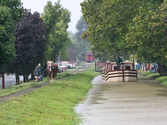 Horse-drawn canal boats glide past like they're auditioning for a Norman Rockwell painting come to life.