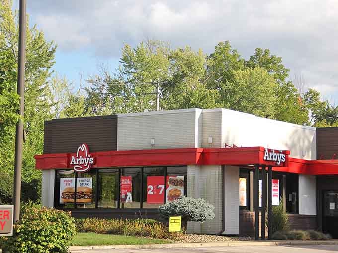 That familiar red hat welcomes travelers looking for a quick bite in a town where even fast food feels friendlier somehow.