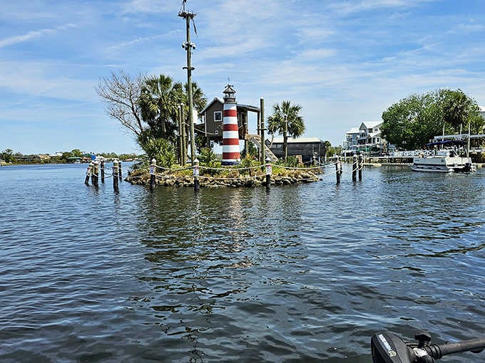 That striped lighthouse on the miniature island creates a postcard-perfect scene that monkeys call home sweet home.