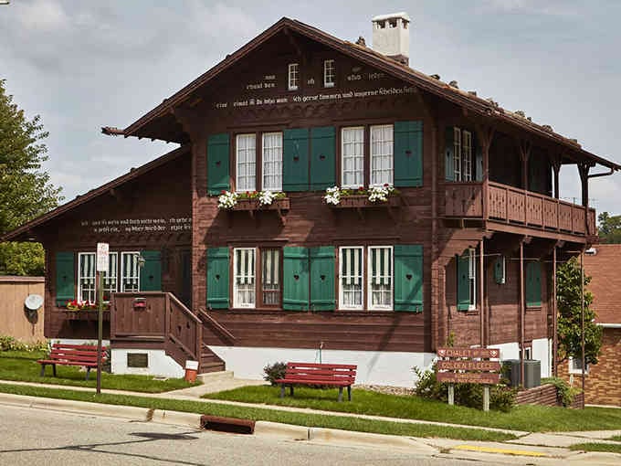 That authentic Swiss chalet looks like it was plucked from the Alps and dropped here, complete with carved details and mountain charm.