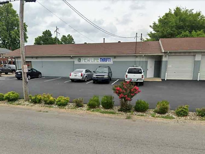 The simple exterior and blooming landscaping create an inviting atmosphere where community spirit meets smart shopping every single day.