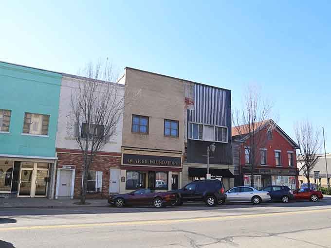 Pastel storefronts and bare winter trees show a downtown that's real, affordable, and ready for your next chapter.