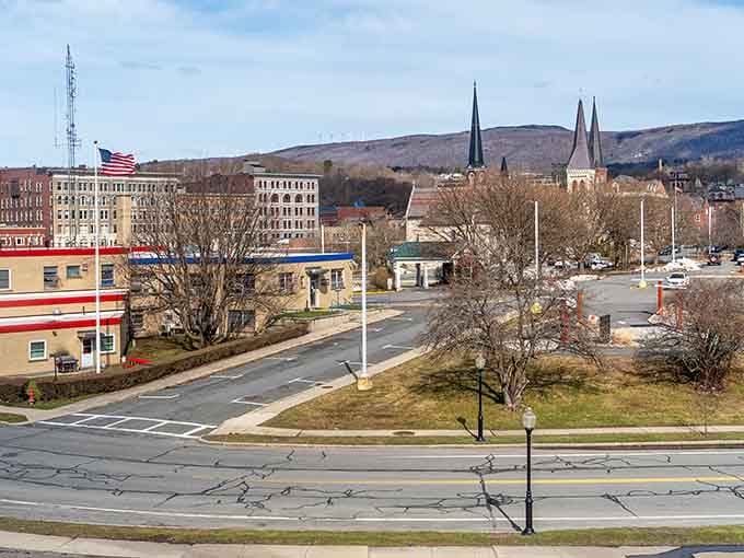 Church steeples dot the skyline like punctuation marks in a story written across generations of New England history.