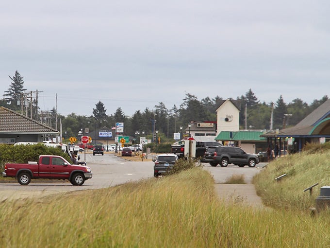 Beach grass sways in ocean breezes while everyday commerce hums along, blending coastal beauty with practical living perfectly.