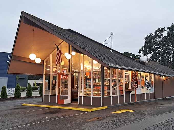 Evening light transforms this retro building into a warm haven where the American flag waves proudly overhead.