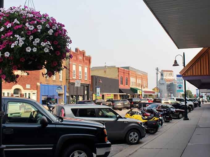 Hanging flower baskets add bursts of color to a downtown where parking spots outnumber traffic jams.
