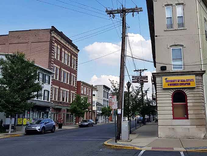 Classic downtown architecture meets modern life where corner buildings anchor intersections like old friends keeping watch together.
