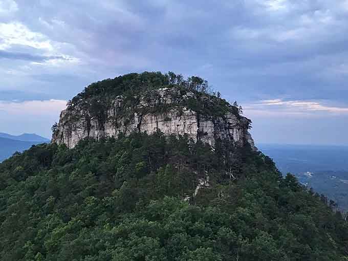 Dusk settles over the pinnacle as shadows deepen, creating a scene worthy of any classic Western movie backdrop.