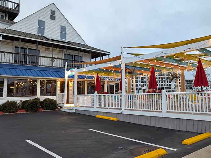 The cheerful yellow canopy shelters outdoor diners like a sunny umbrella, promising casual waterside feasts ahead.