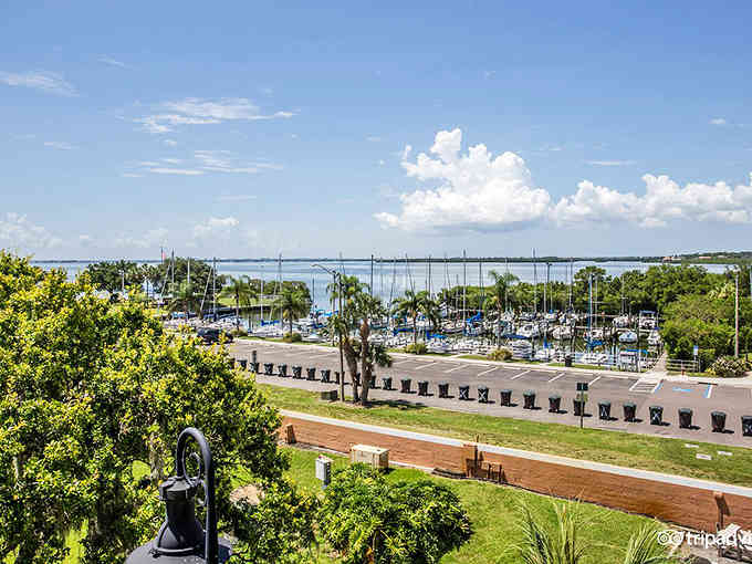 Marina life meets manicured lawns where sailboats bob gently and the biggest decision is whether to fish or relax.