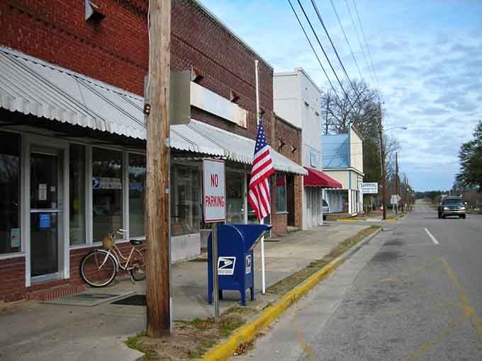 The American flag and brick storefronts stand as proud reminders of communities built on handshakes and honest work.