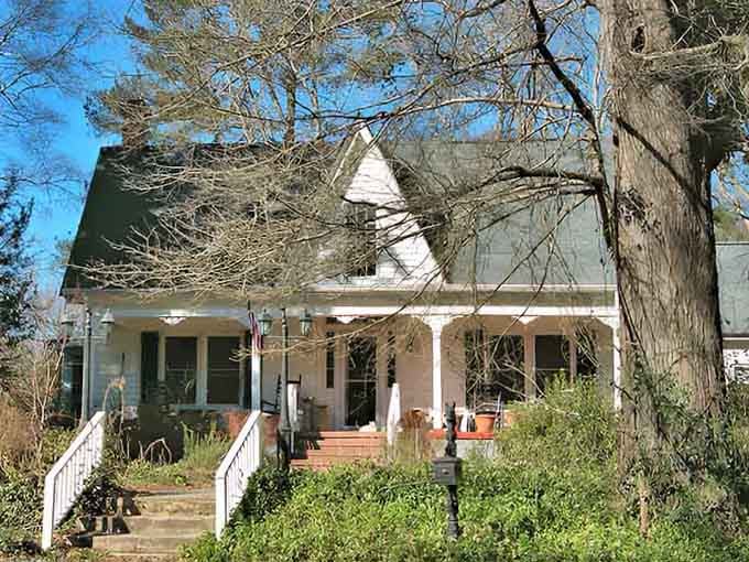 Behind that white picket fence and welcoming porch, you can almost hear the screen door creak and smell supper cooking.