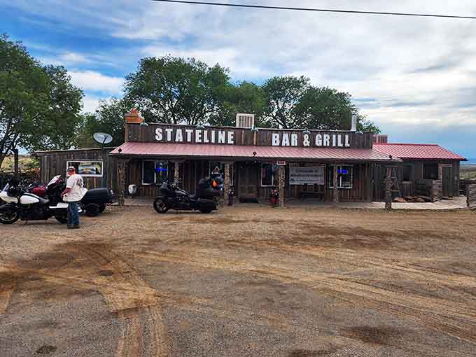 The dirt parking lot and authentic Old West facade promise an experience as real as the remote landscape surrounding it.