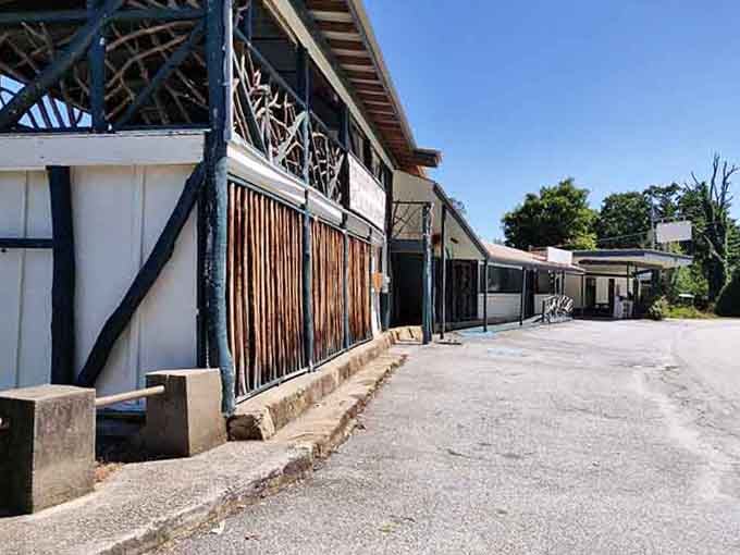 Historic architecture meets modern preservation where rustic beams frame a street that time treats kindly.