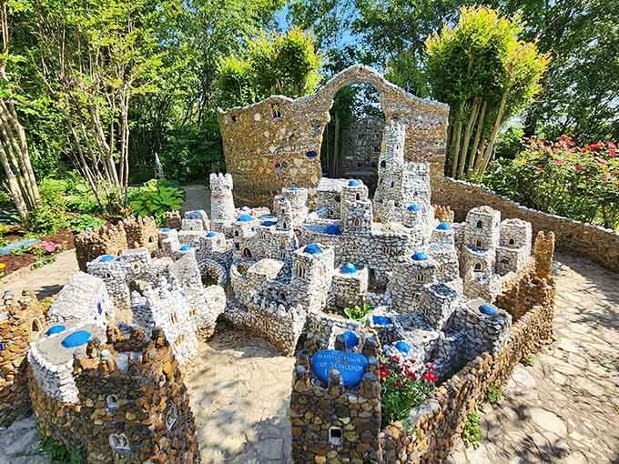 Colorful glass and carefully placed stones create a whimsical village that proves patience and imagination build wonders.
