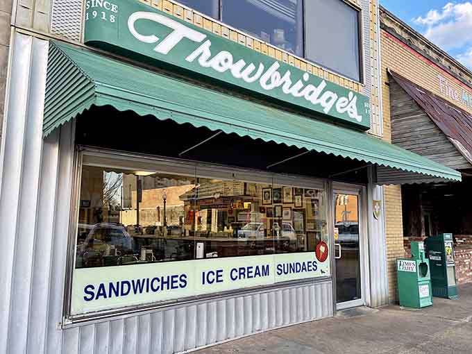 The corrugated metal facade and classic script font scream authentic old-school soda fountain vibes perfectly.