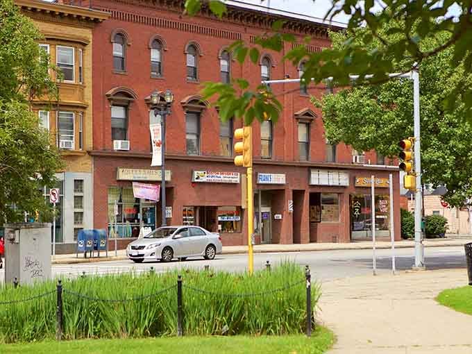Historic storefronts and green spaces blend together like ingredients in your grandmother's best recipe, perfectly balanced.