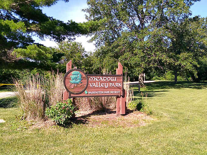 Meadow Valley's wooden sign stands proud among the prairie grasses like a bookmark in nature's favorite chapter.