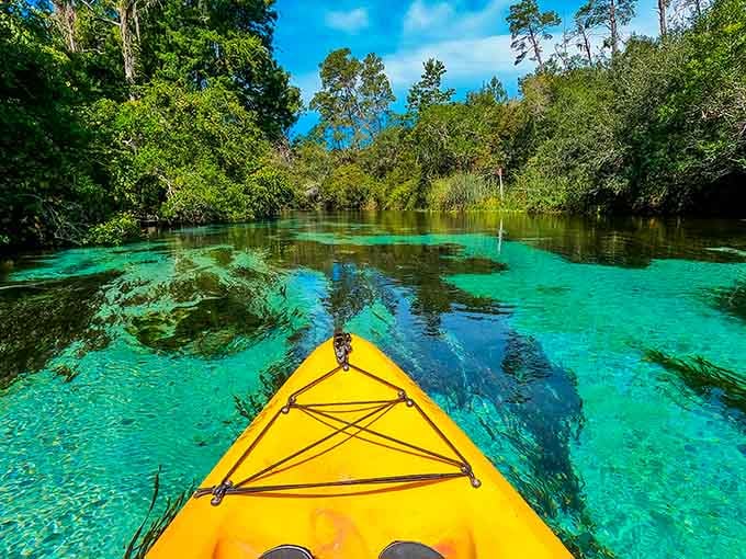 That yellow kayak points the way to adventure through water clear enough to count pebbles on the bottom.