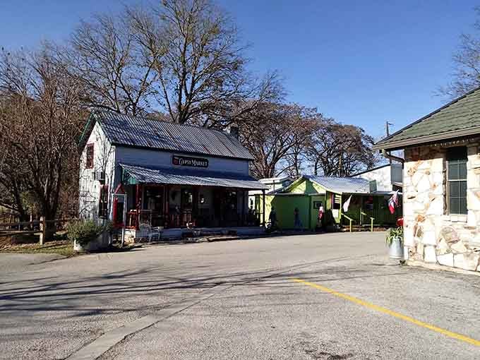 Bare branches frame these charming shops where local artisans sell their wares and every purchase supports your neighbor's dream.