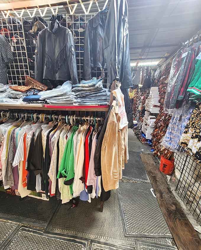 Leather jackets hang alongside pastel blouses, creating a fashion timeline that spans decades of changing tastes.