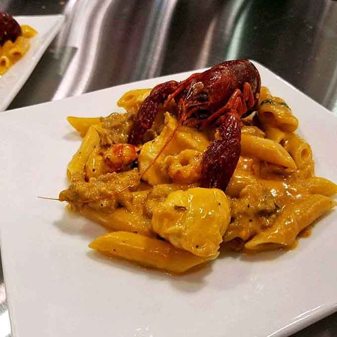 That whole lobster perched atop creamy pasta is the definition of living your best life right now.