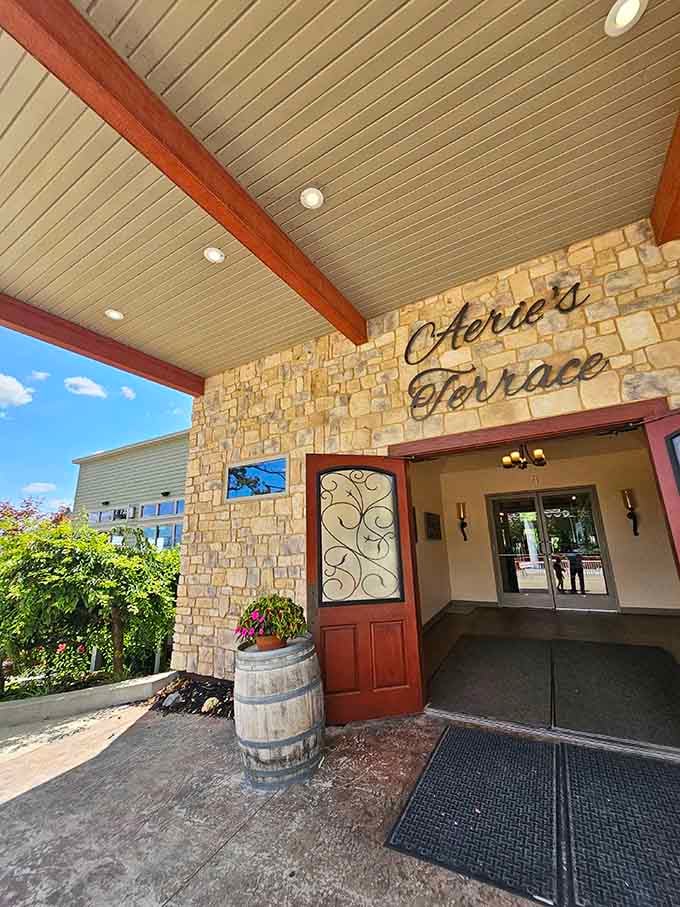 Stone and timber frame the entrance to elevated dining where the view rivals any coastal resort.