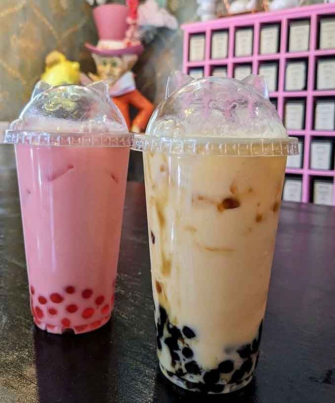 Two bubble teas side by side—one pink, one creamy—proving that choosing favorites is wonderfully impossible.