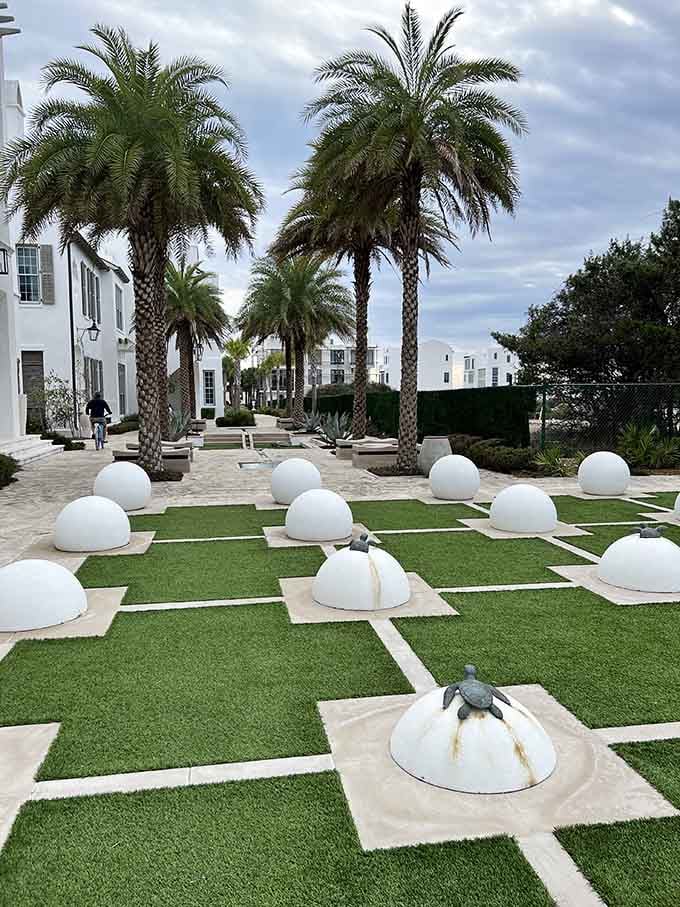 Those white dome sculptures dotting the lawn look like someone planted giant eggs, and somehow it works beautifully here.