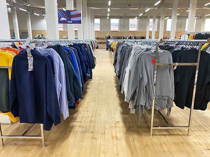 Color-coded clothing racks that make finding your size feel less like archaeology and more like shopping.