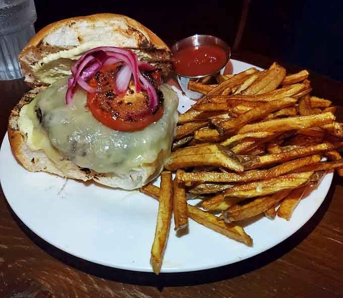 This burger comes with melted cheese and pickled onions that could make a vegetarian reconsider their life choices.