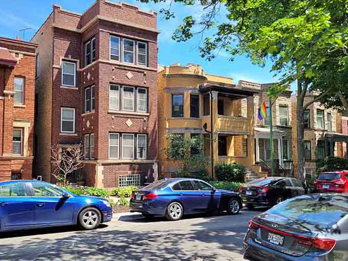 Colorful facades line residential streets where architectural diversity is celebrated, not bulldozed for cookie-cutter condos.