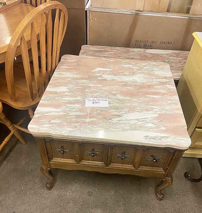 This marble-topped table with ornate carved details screams 1970s elegance, just waiting for the right DIY enthusiast's touch.