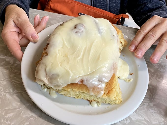 This cinnamon roll is roughly the size of a dinner plate and absolutely zero apologies are offered.