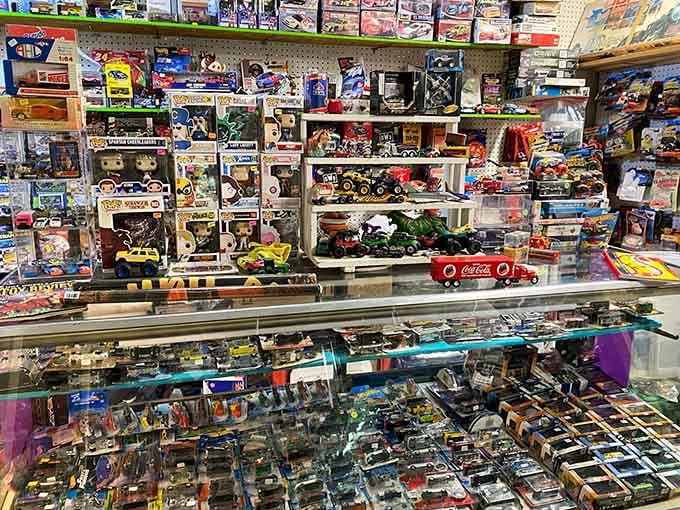 Display cases packed with collectible toys and die-cast cars create a nostalgia bomb that hits harder than expected.