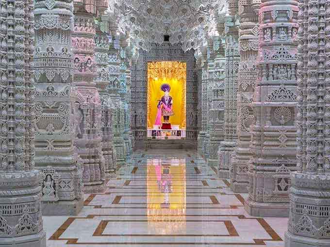 Hand-carved marble pillars stretching toward an ornate ceiling that redefines what "attention to detail" actually means in architecture.
