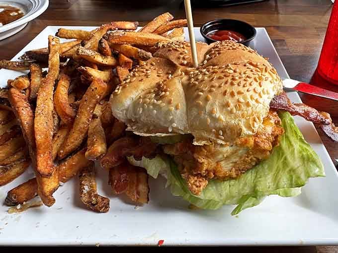 That chicken sandwich means business, stacked high and served with fries that know their purpose in life.