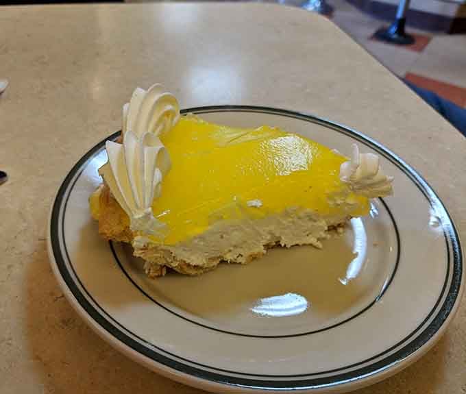 Lemon meringue pie with peaks so perfectly browned, it looks like a delicious mountain range you'll happily climb.